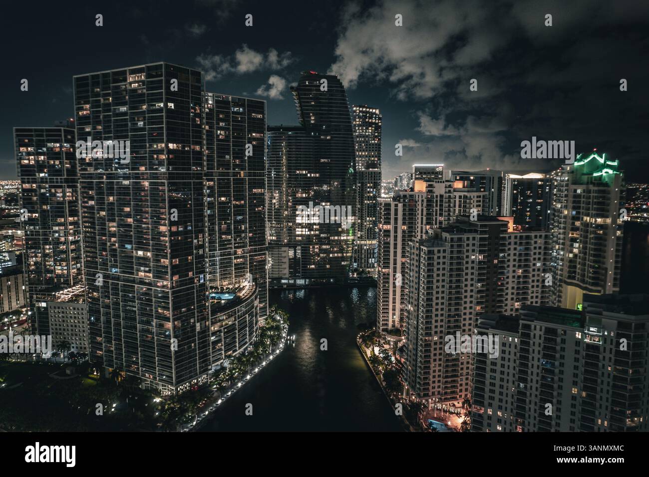 Aerial view of Miami skyline at night with waterfront river, Florida ...