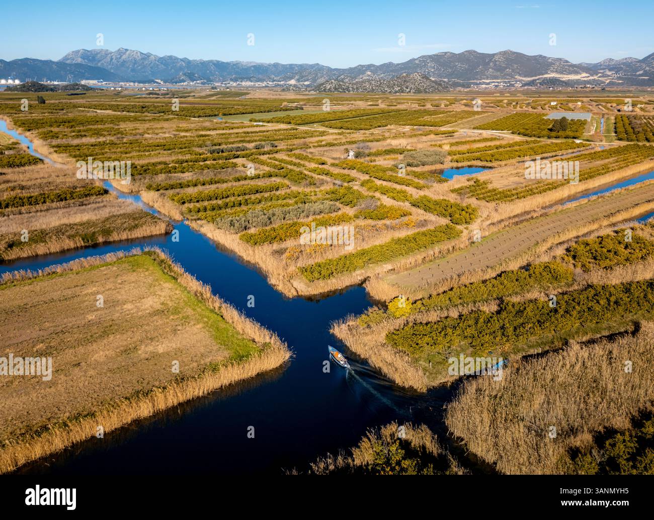 Aerial view of the serene Neretva delta with a tranquil river and ...