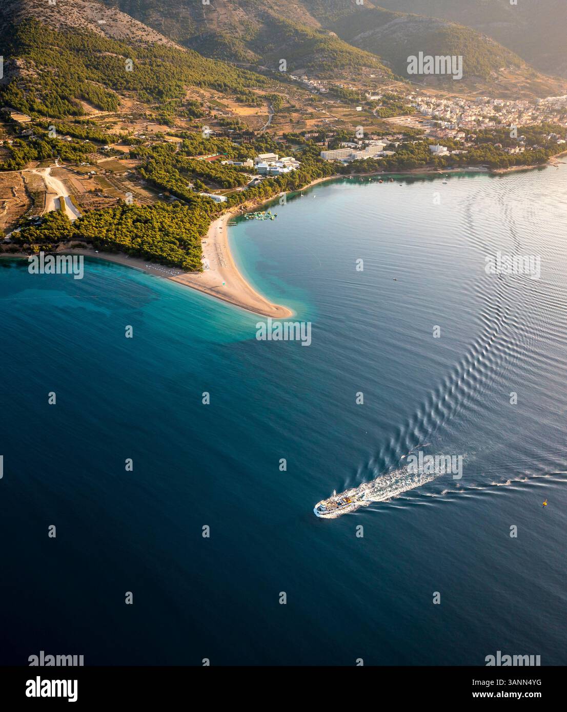 Aerial view of a passenger boat sailing near the coastline in Split ...
