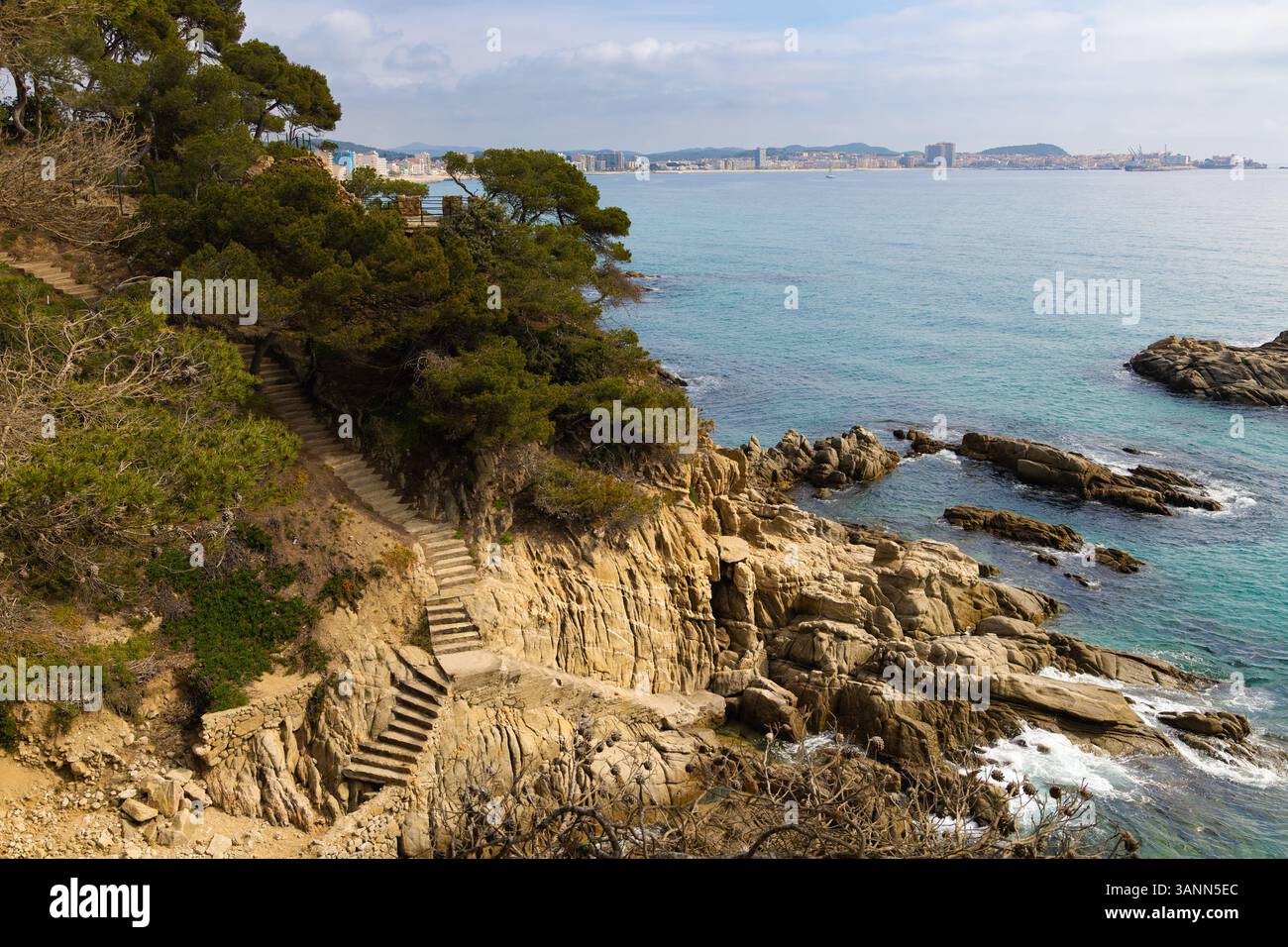 Coastal stairs winding down rocky cliffs at Punta Rocas Planes, Costa ...