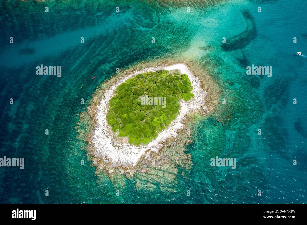 Aerial view of Otocic Kolona island surrounded by turquoise water in ...