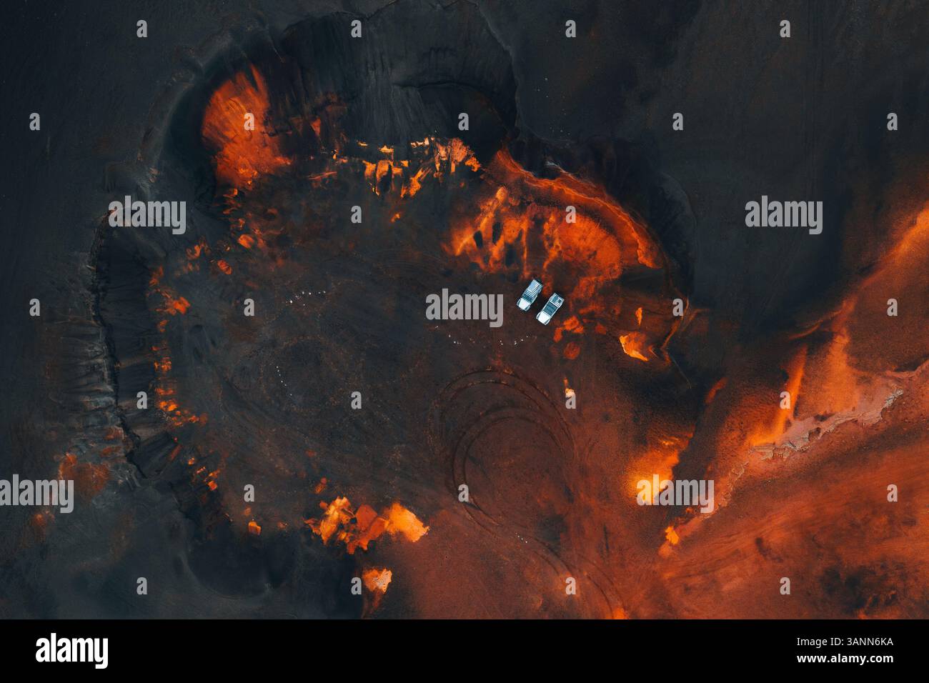 Aerial view of rugged volcanic area with lava formations and a Land ...