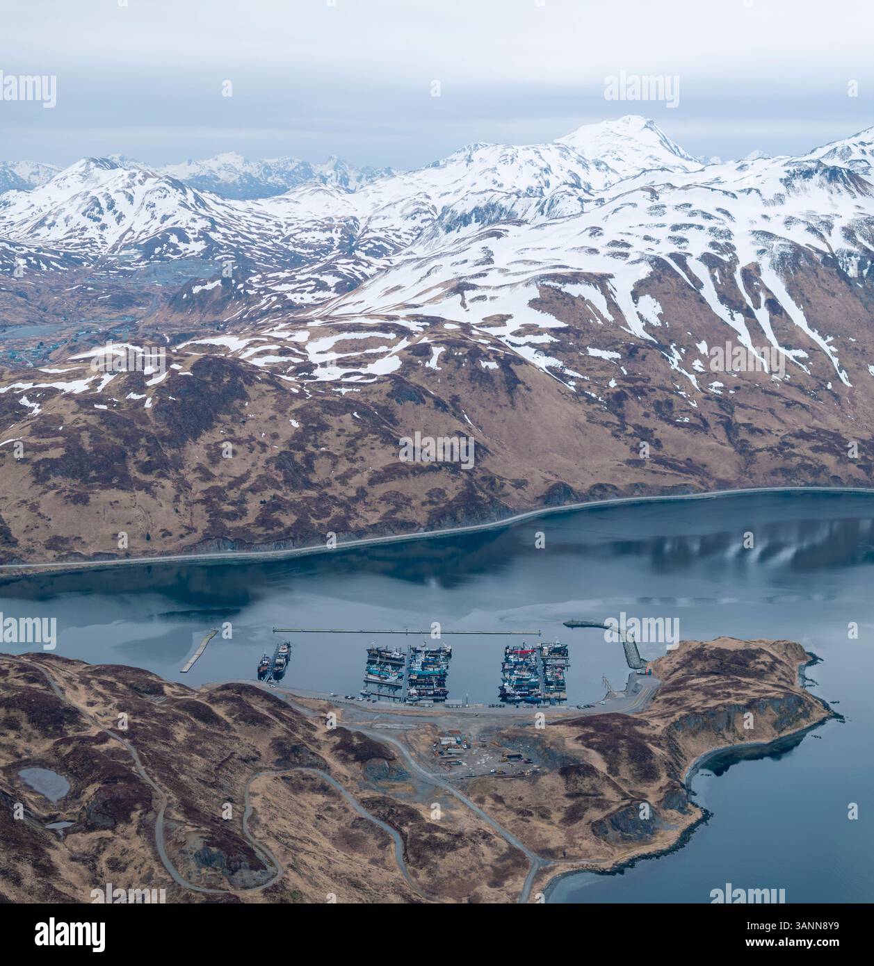 Aerial view of serene and majestic snowcapped mountains surrounding a ...