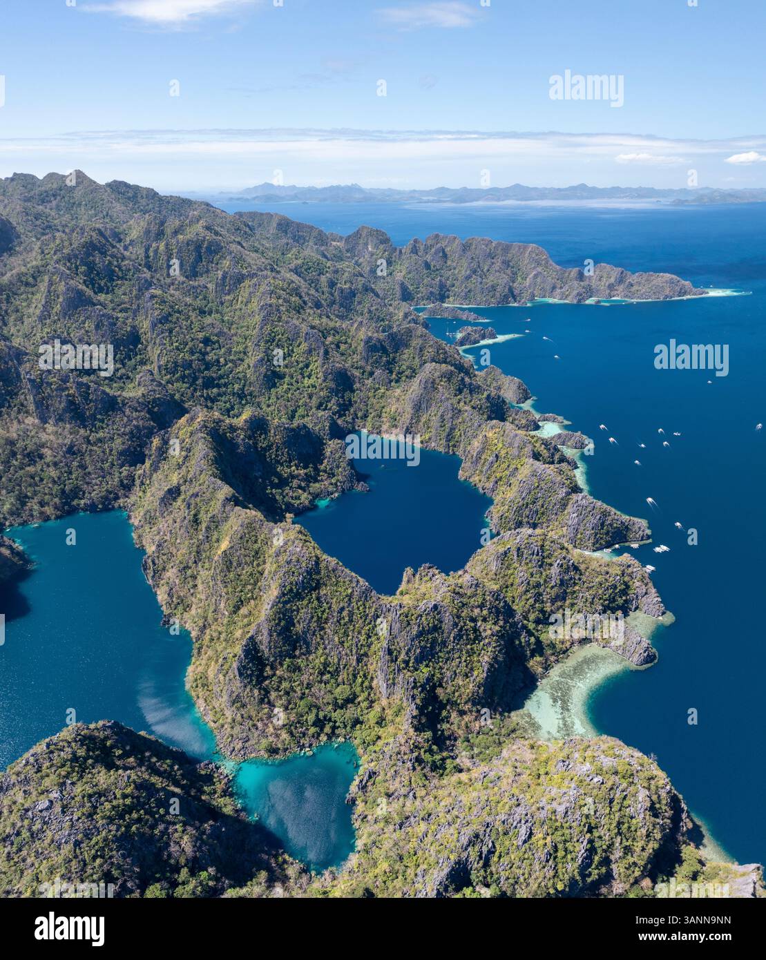 Aerial view of a beautiful tropical island with crystal clear water and ...