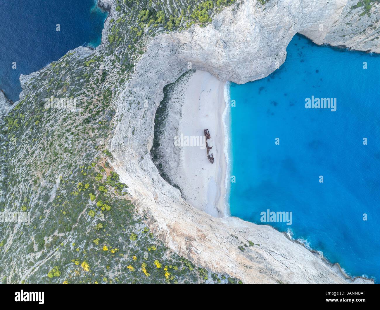 Aerial view of navagio beach with a shipwreck surrounded by turquoise ...