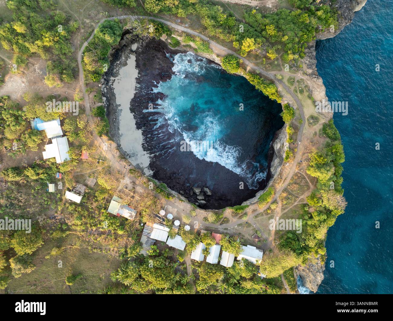 Aerial view of broken beach with turquoise water and cliffs, Nusa ...