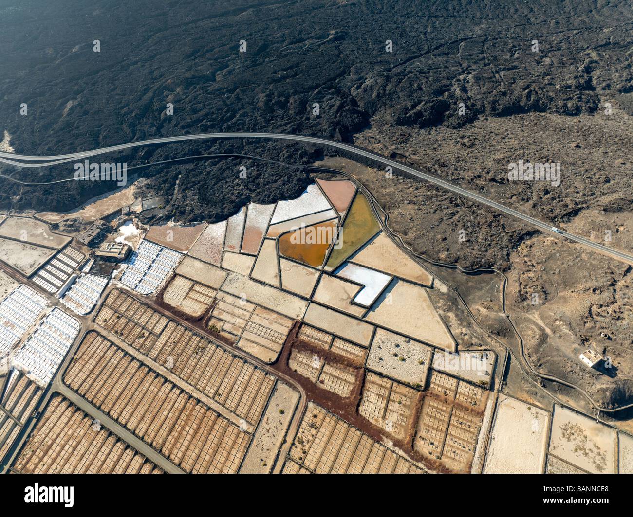 Aerial view of beautiful geometric patterns of salt flats and rocky ...
