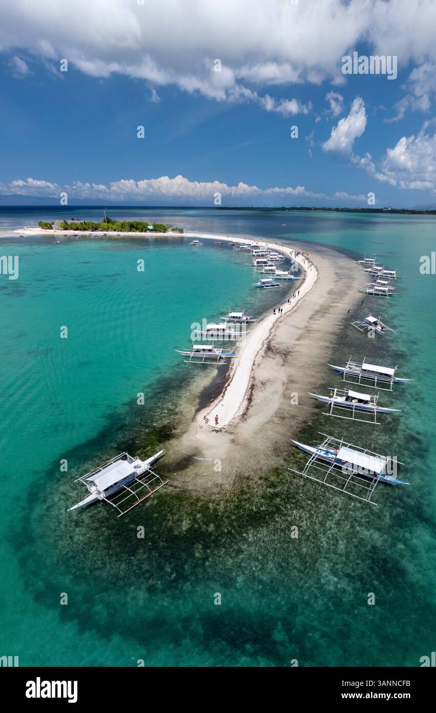 Aerial view of beautiful tropical sandbar with boats in turquoise water ...