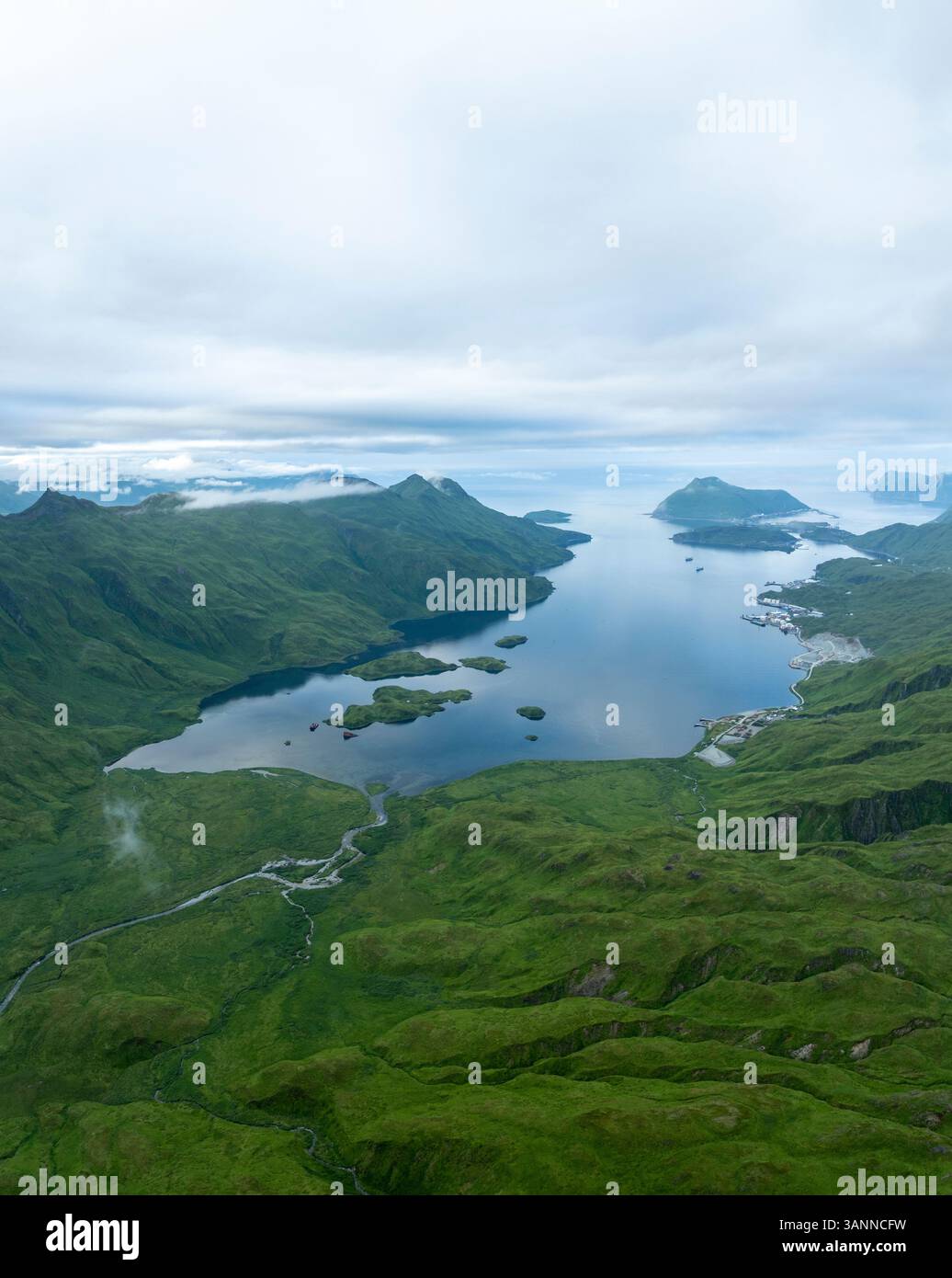 Aerial view of serene captains bay surrounded by majestic mountains and ...