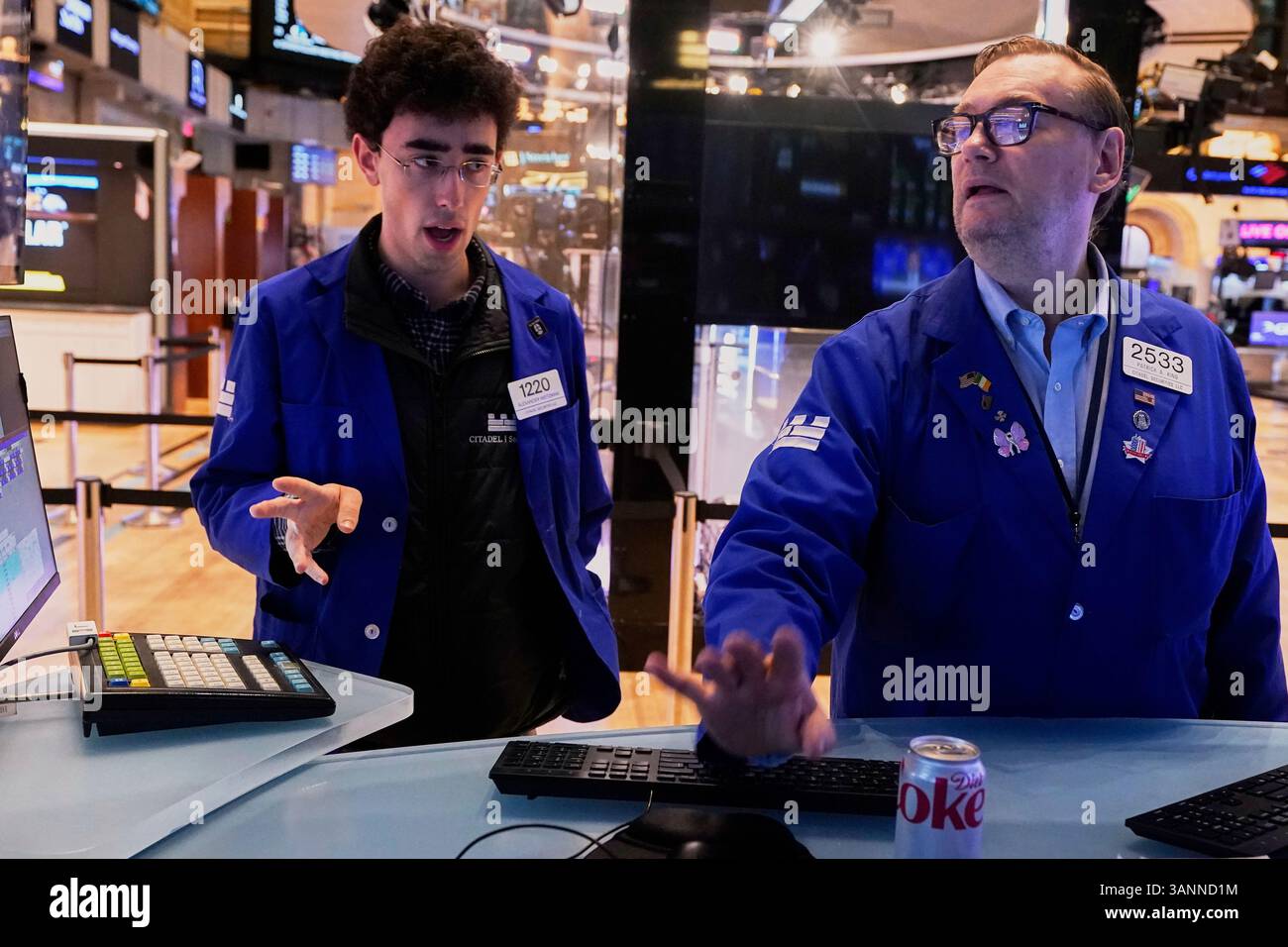 Specialists Alexander Weitzman, left, and Patrick King work on the ...