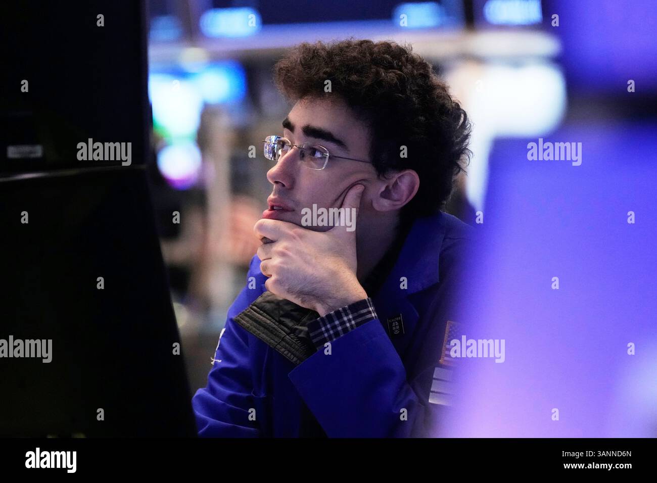 Specialist Alexander Weitzman works on the floor of the New York Stock ...