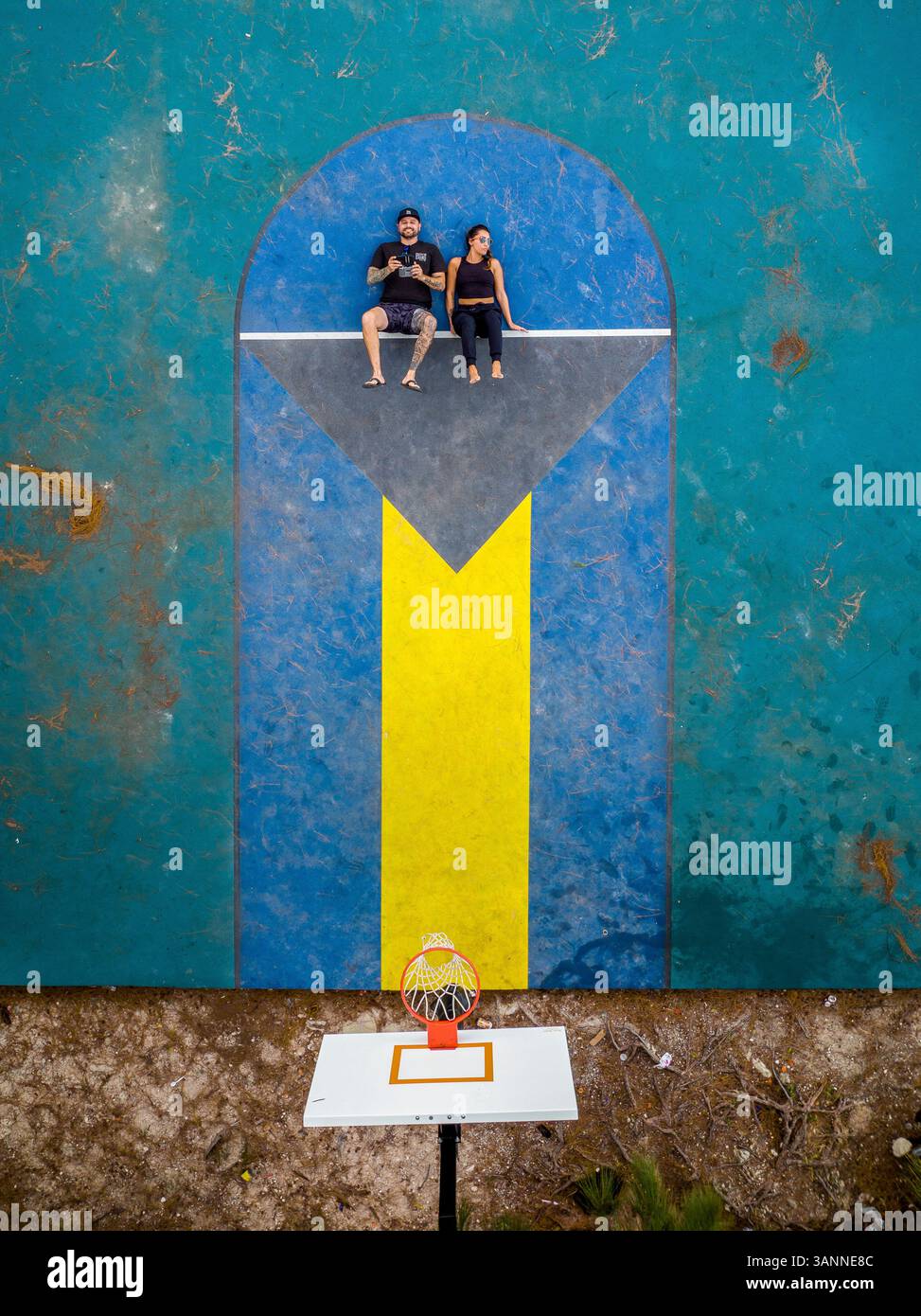 Aerial view of a vibrant basketball field with colorful murals and ...