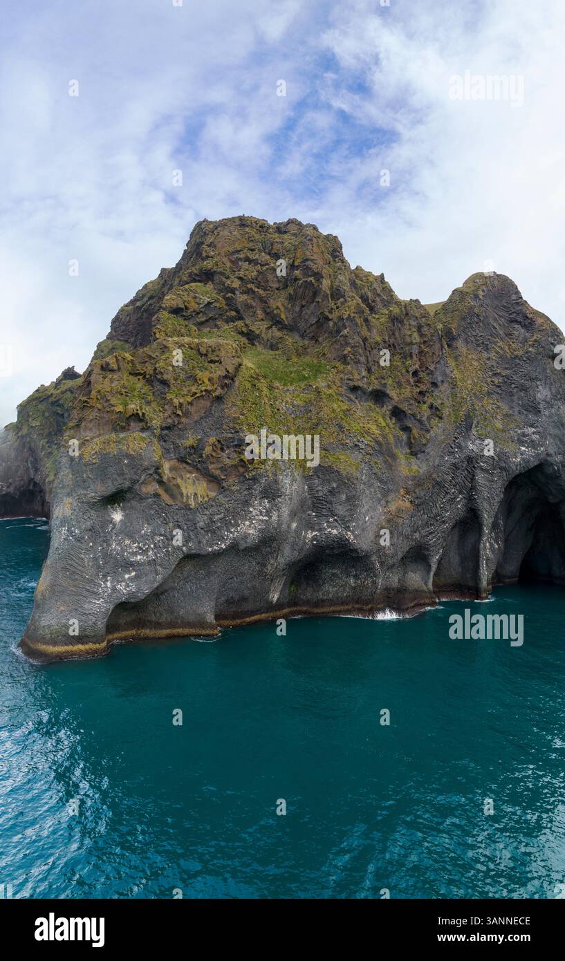 Aerial view of elephant rock surrounded by the ocean and dramatic ...