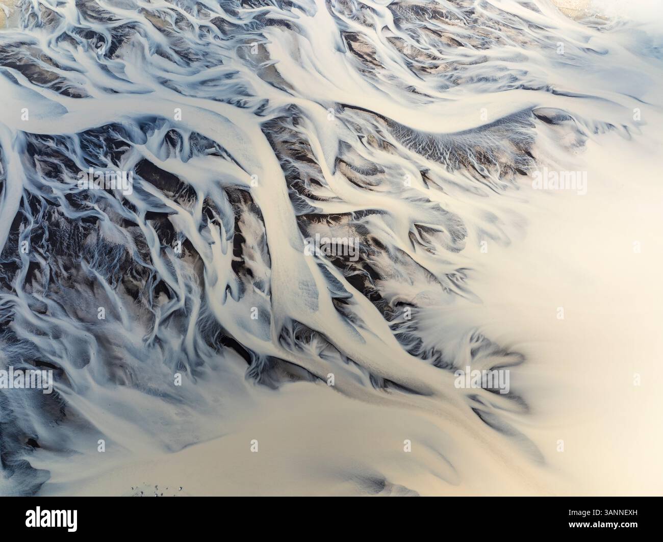 Aerial view of beautiful and clear river winding through abstract ...