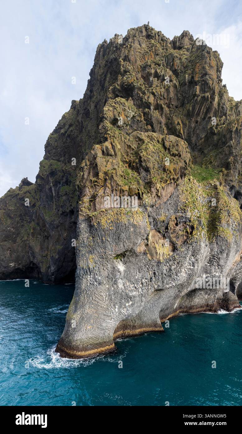 Aerial view of elephant rock and rugged cliffs by the blue ocean ...
