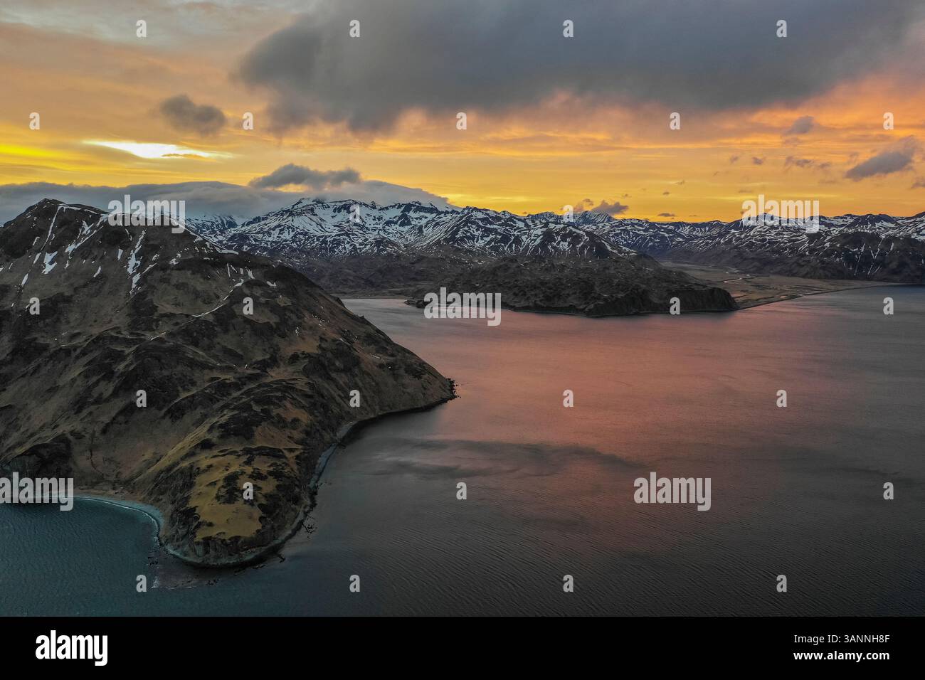 Aerial view of a mountain range with snow on the crests along the Dutch ...