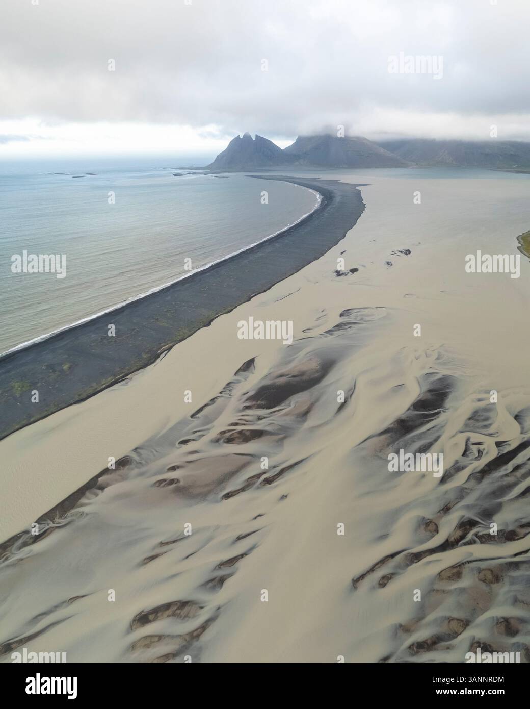 Aerial view of water formation at river estuary and Fjorur beach with ...