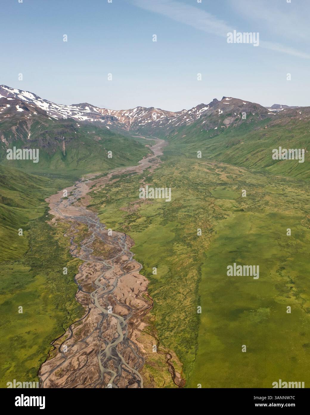 Aerial view of a river streaming along the valley near Captains Bay on ...