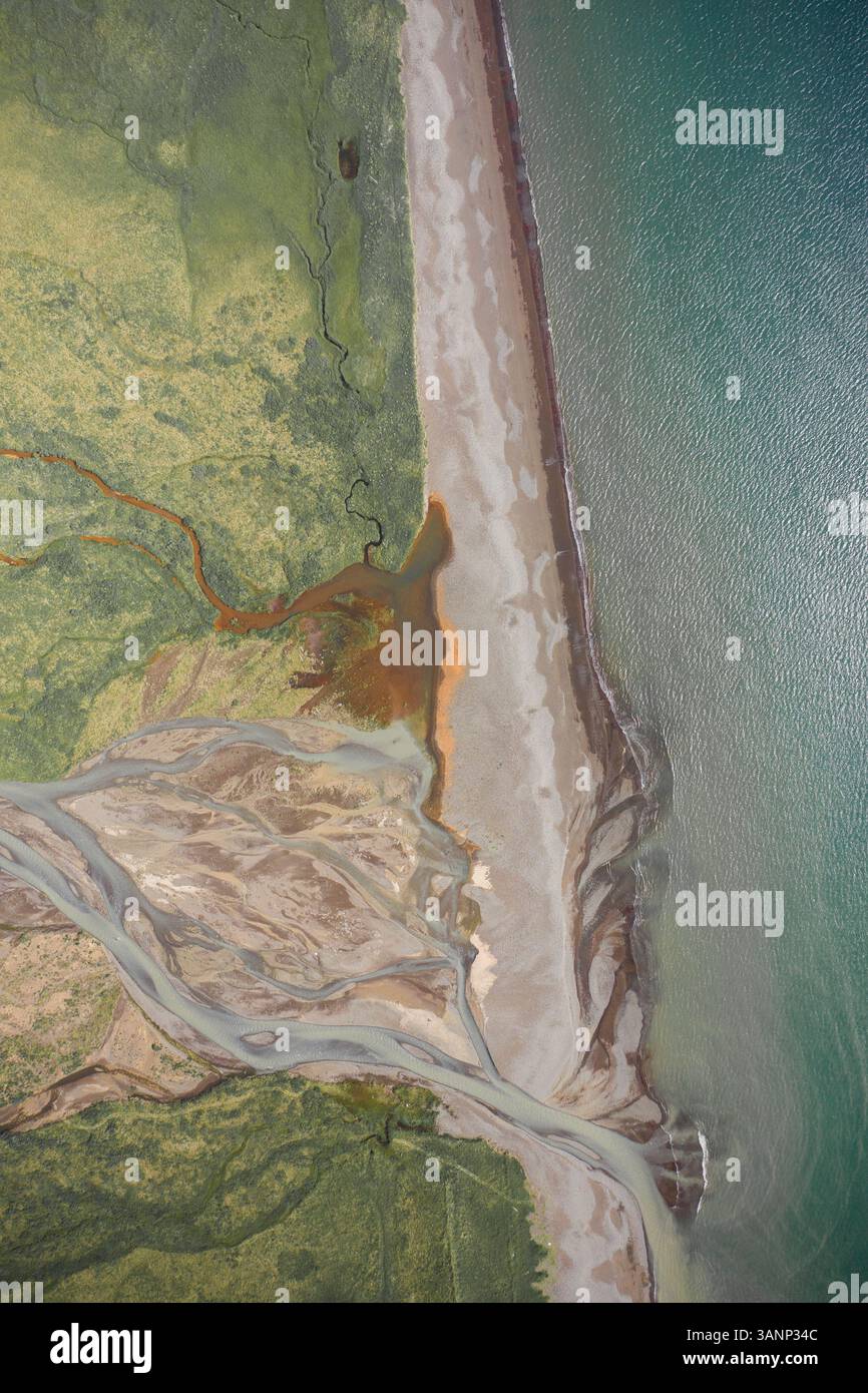 Aerial view of the coastline along Mukushin Bay, Unalaska island ...
