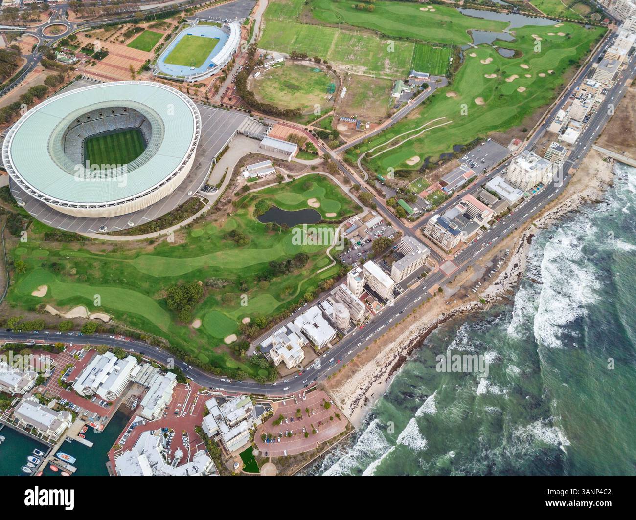 Aerial view of Green Point stadium, coastal road and buildings, Cape ...