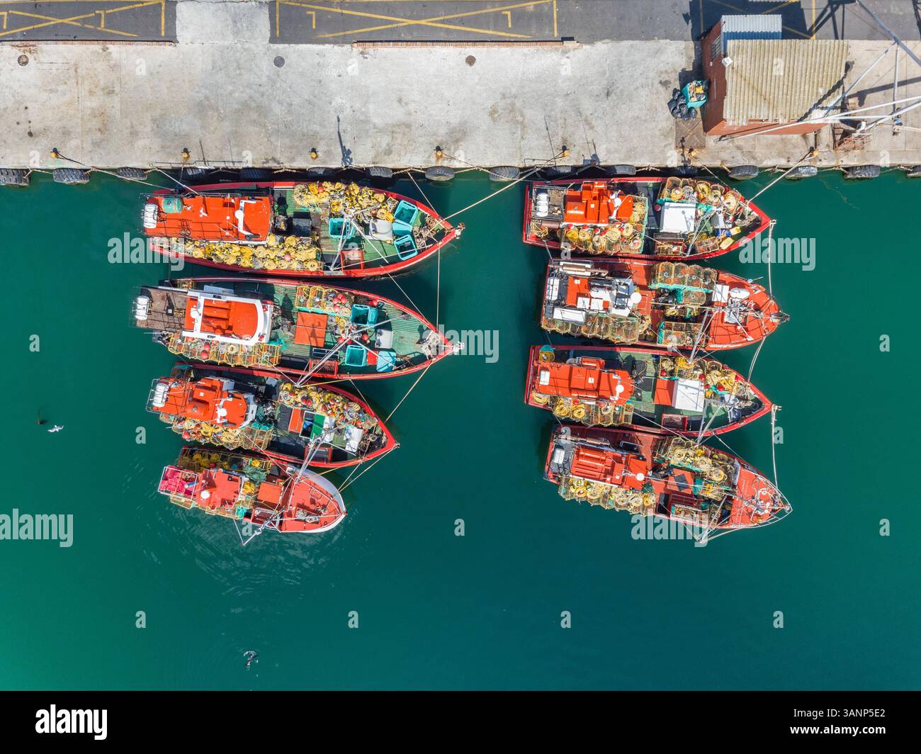 Aerial view of eight fishing boats in Hout Bay, Cape Town Stock Photo ...