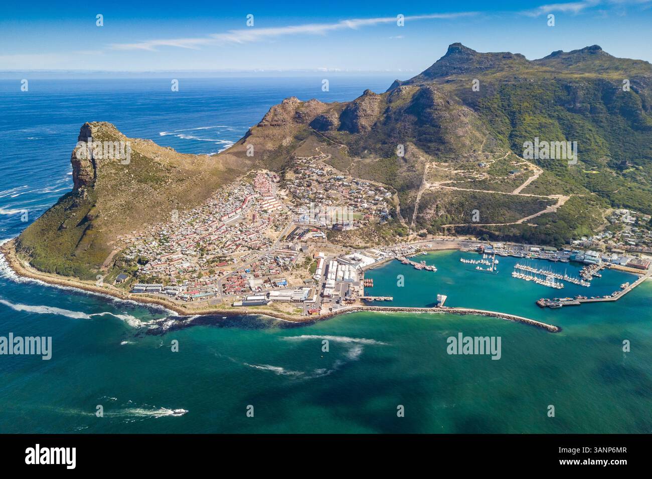 Aerial panoramic view of Hout Bay Harbour, yachts and hillside town ...