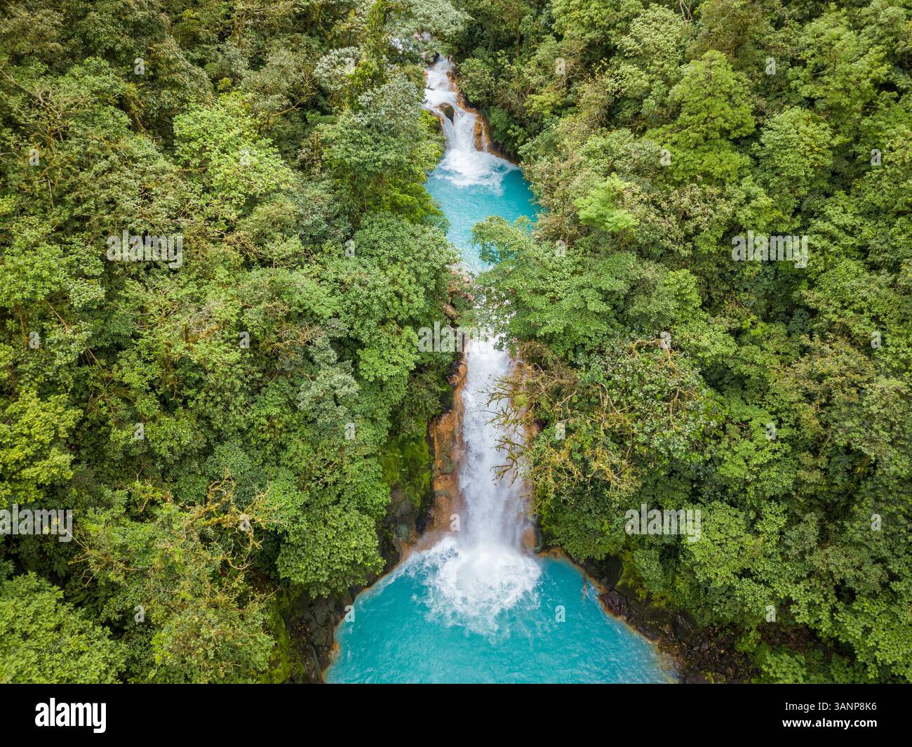Aerial view of natural turquoise pools of Celeste Waterfall, Costa Rica ...