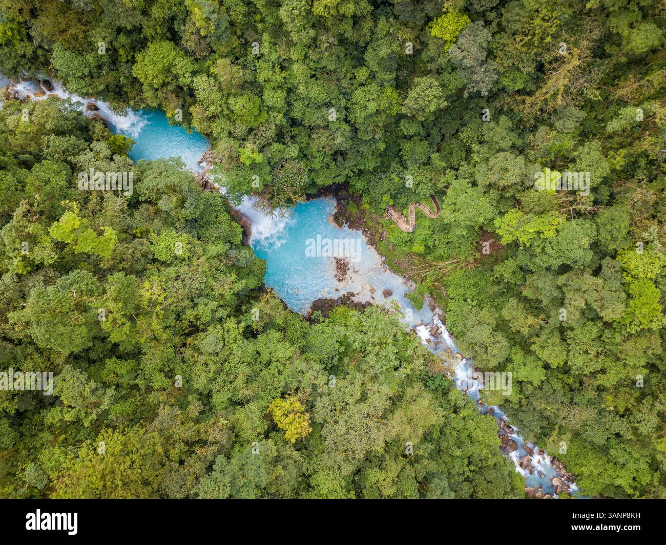 Aerial view of Celeste waterfall in Tenorio Volcano National Park ...