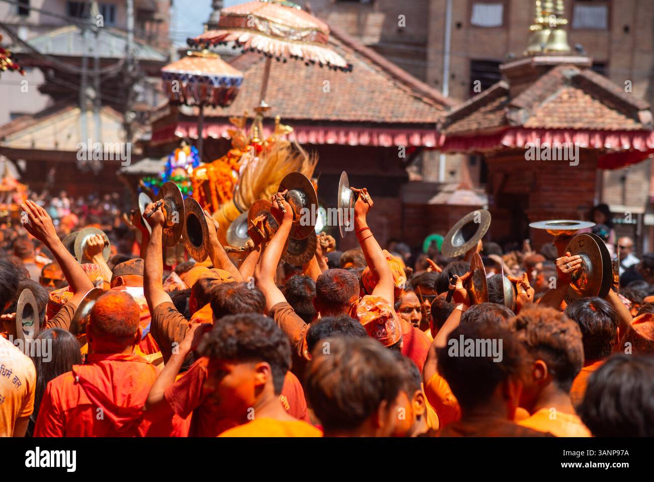 Nepalese devotees playing traditional musical instruments during the ...