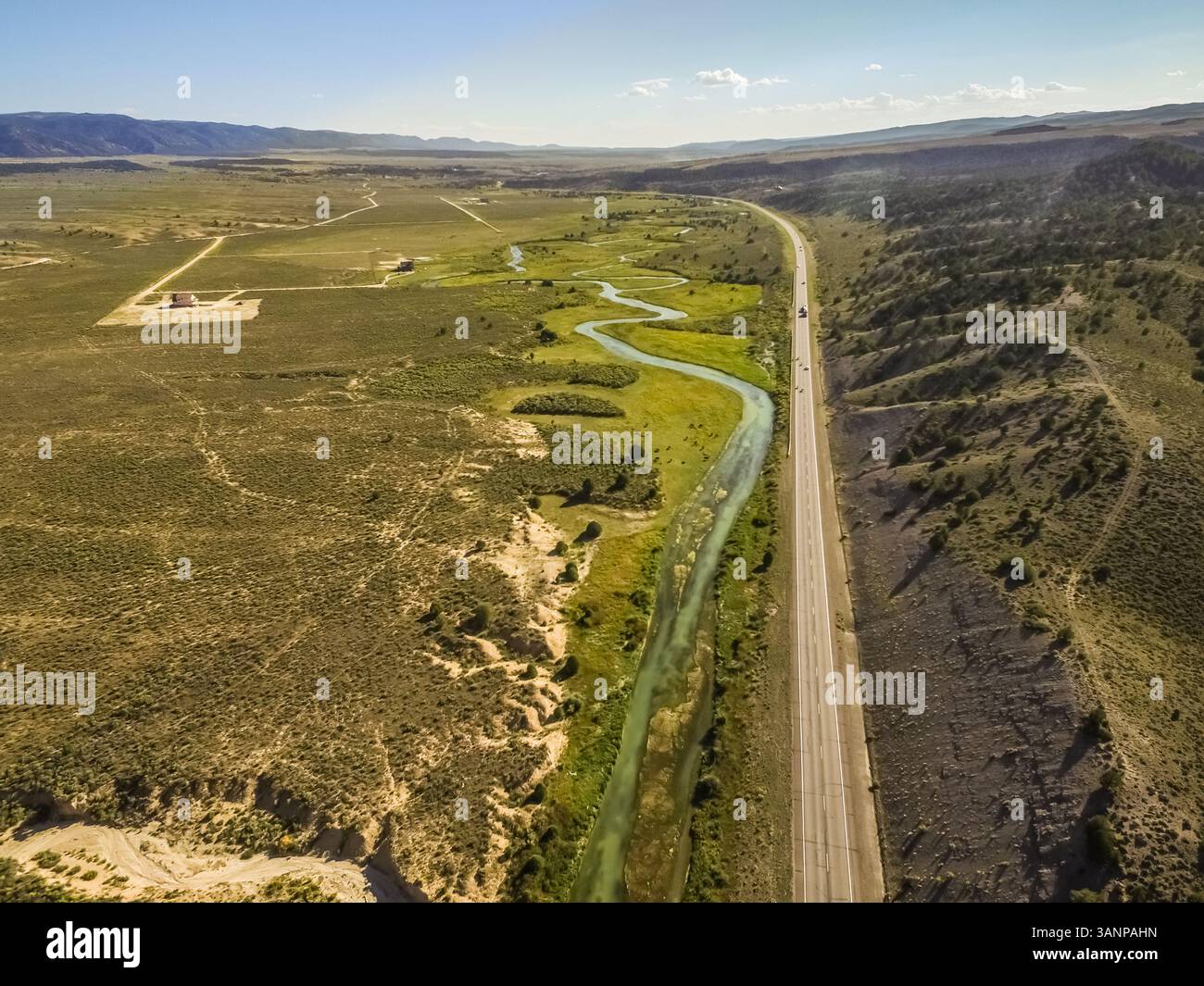 Aerial view of sevier blue river following the road in Hatch, Utah, USA ...