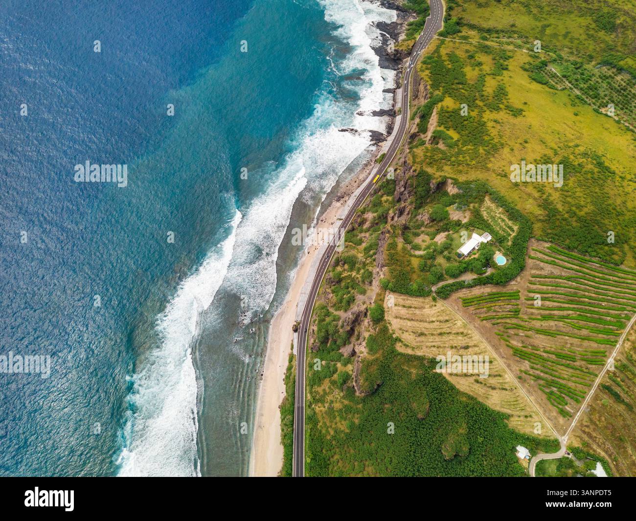 Aerial view of coastal road and swimming pool by Indian Ocean, Reunion ...