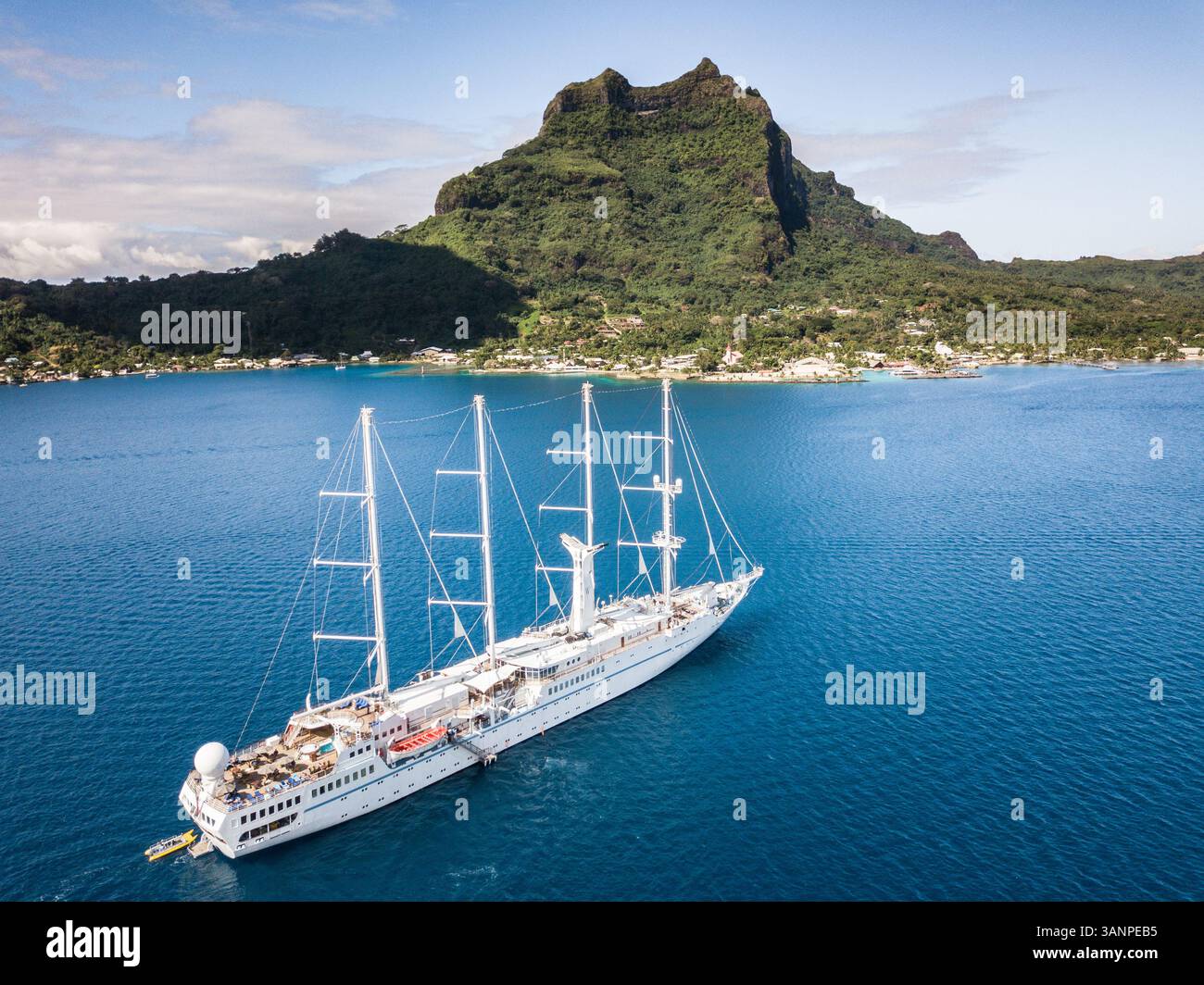 Aerial view of a cruise in the blue sea of Bora Bora with the Mount ...