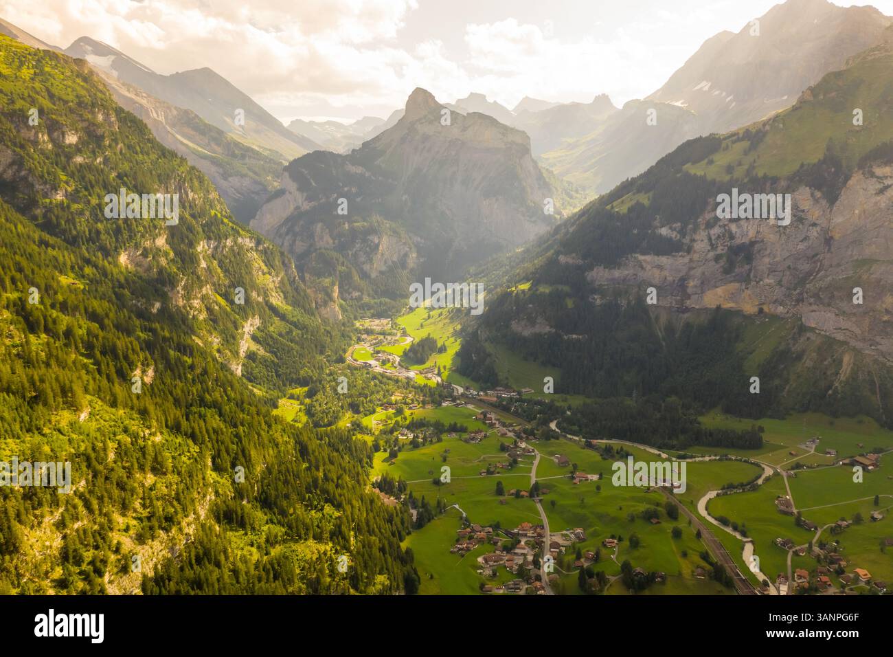 Aerial view of Kandersteg village surrounded by mountains during sunset ...