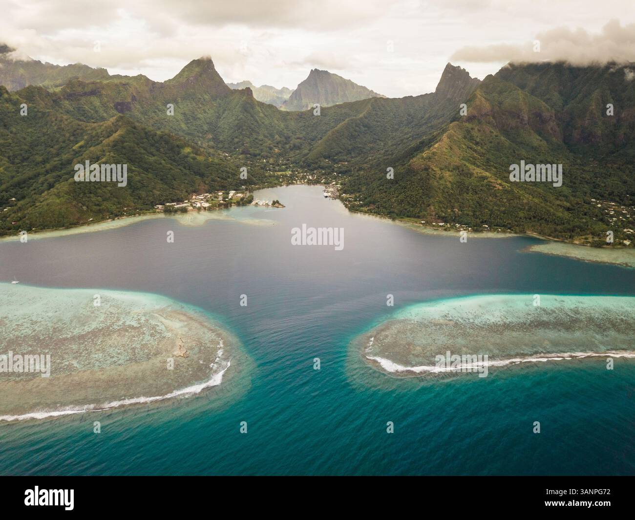 Aerial view of Moorea island and its shallow lagoon surrounded by the ...