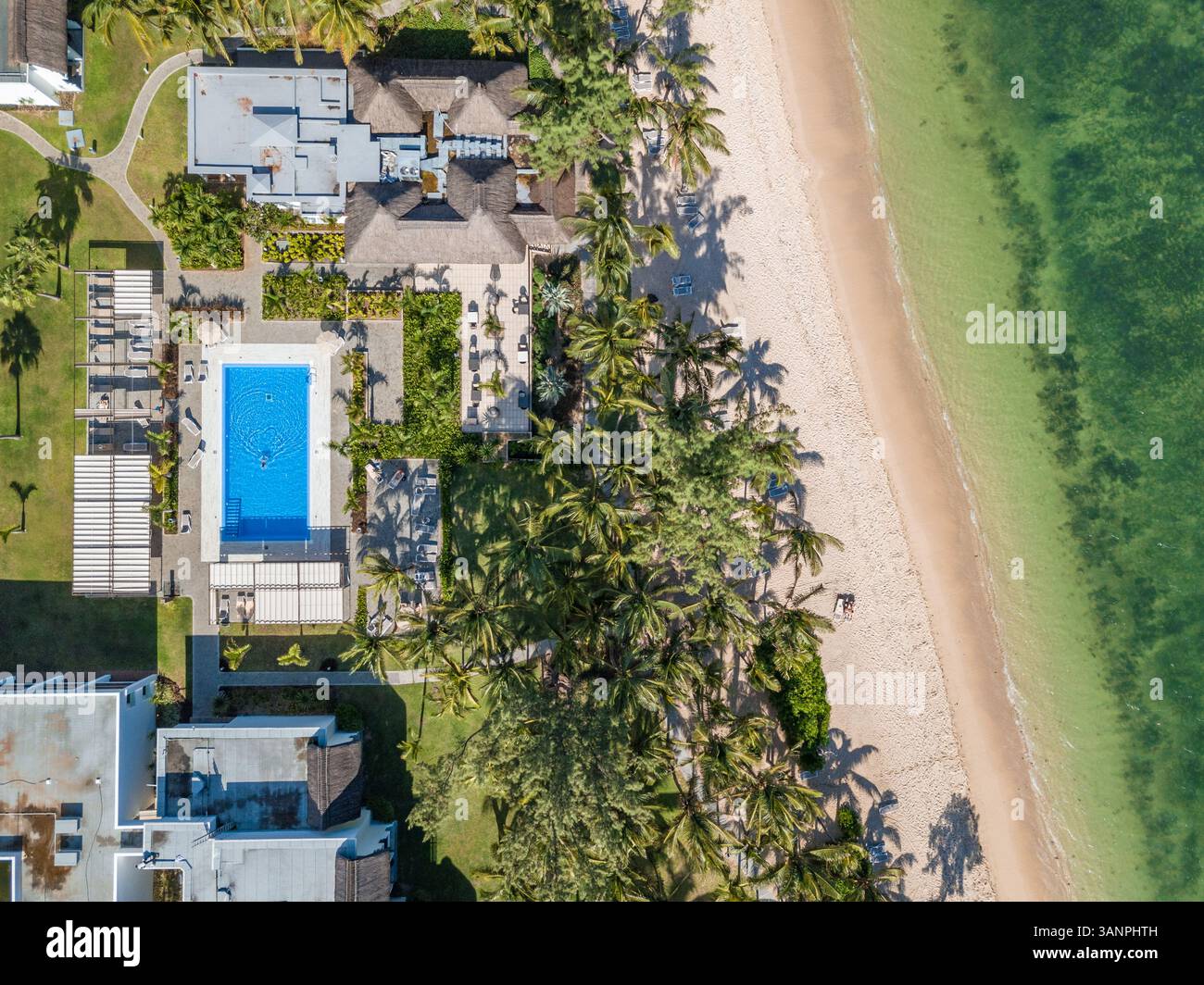 Aerial view of residential area with pool on beachfront, Mauritius ...