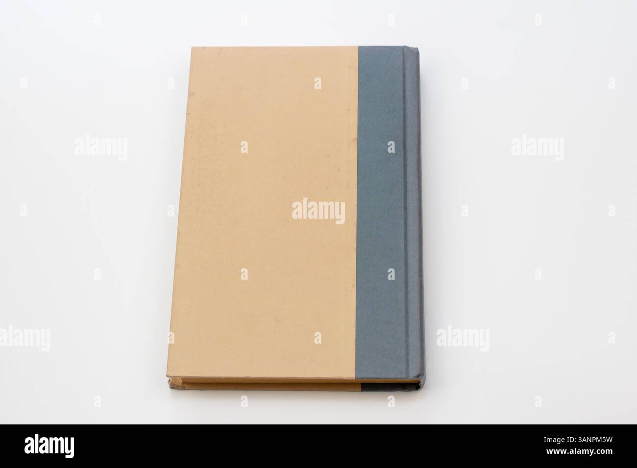 Simple book with a neutral cover on a smooth white surface, suitable ...