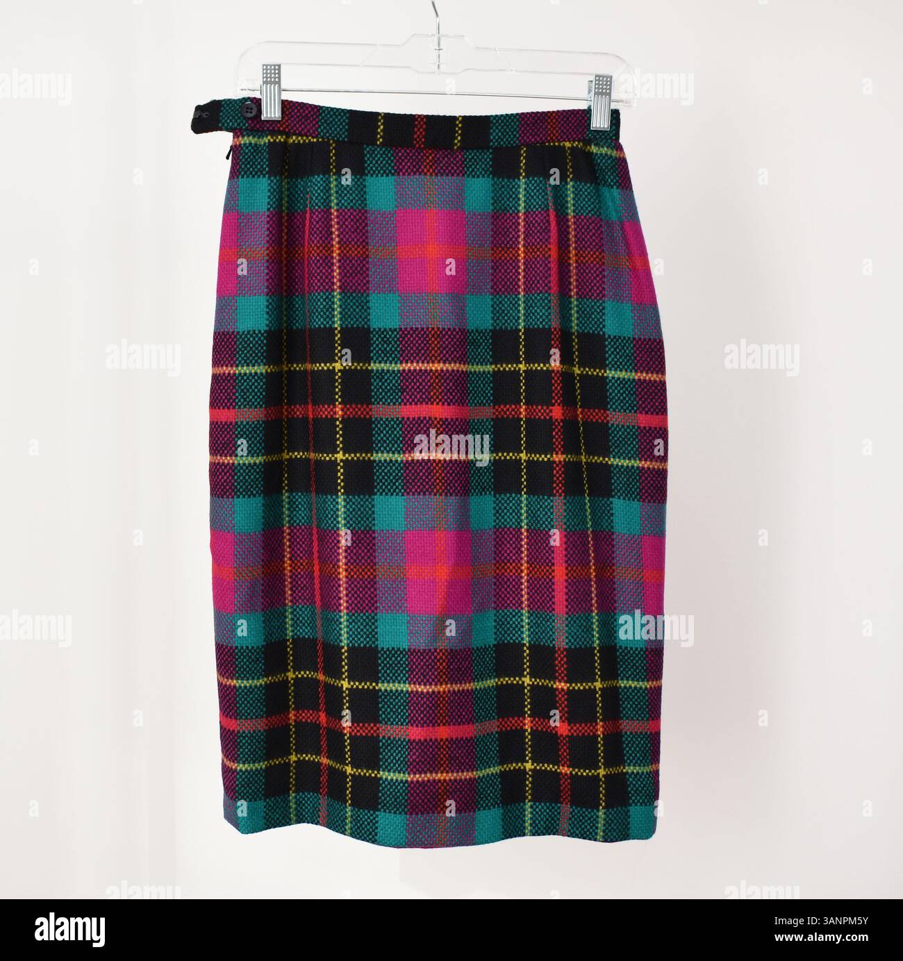 Scottish tartan skirt on hanger on white background Stock Photo - Alamy