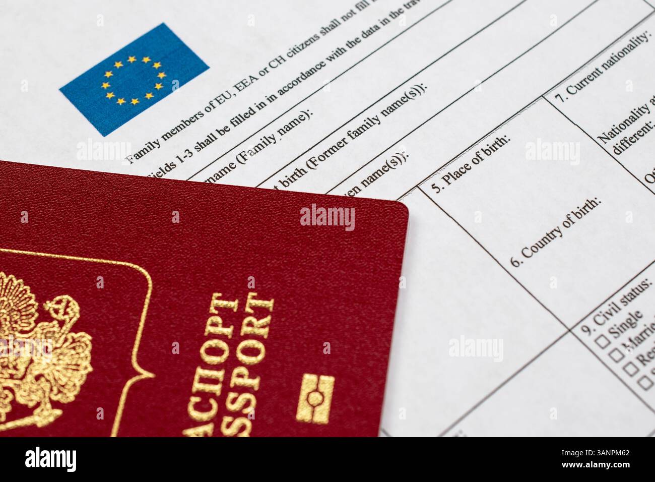 Russian passport with Schengen visa application form on desk, tourist ...