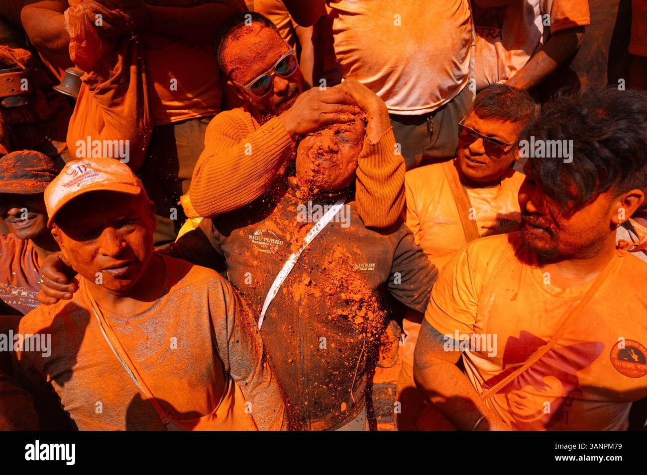 Devotees covered with vermilion powder celebrate "Sindoor Jatra ...