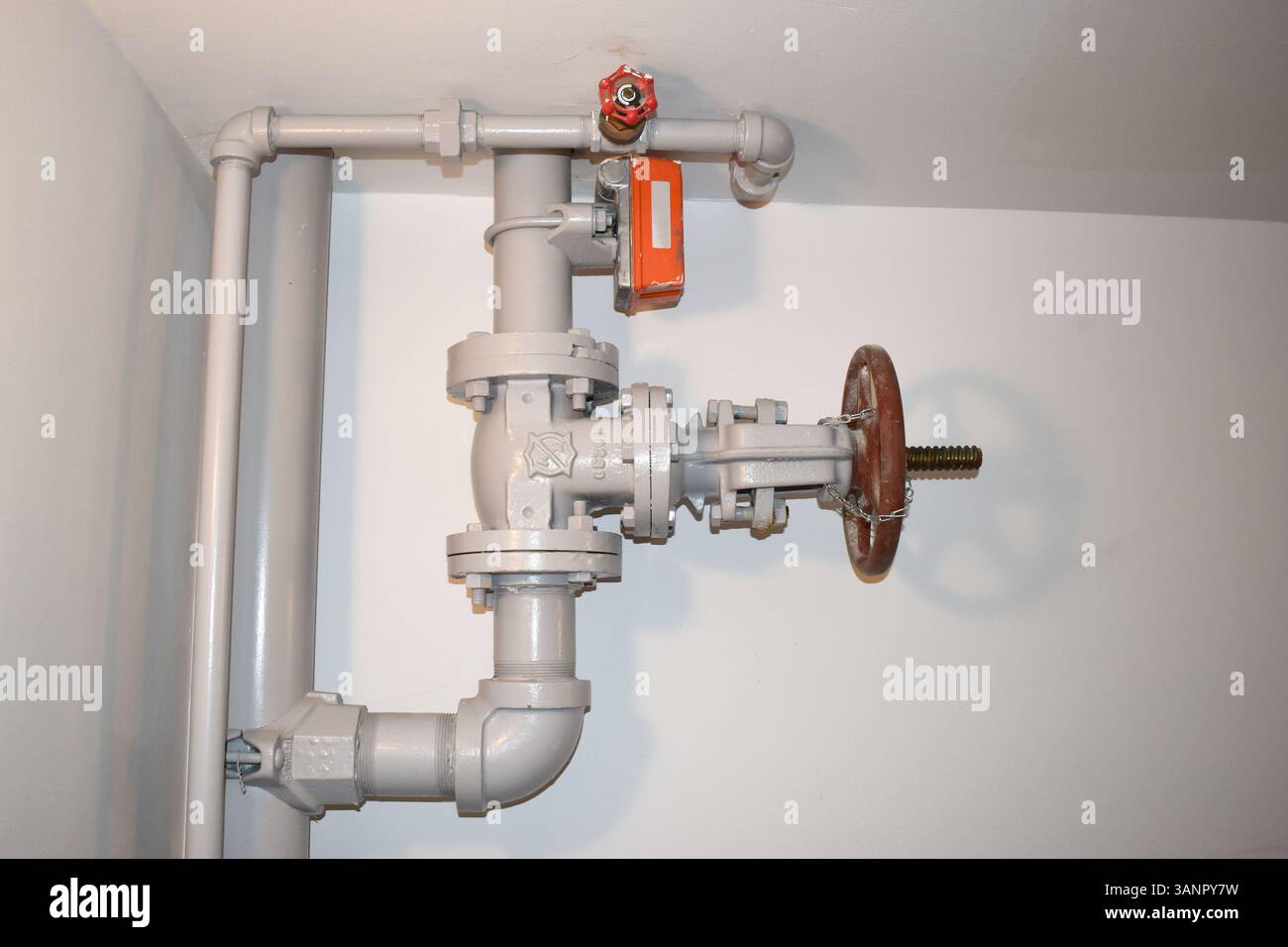 A pipe system with a large valve Stock Photo - Alamy