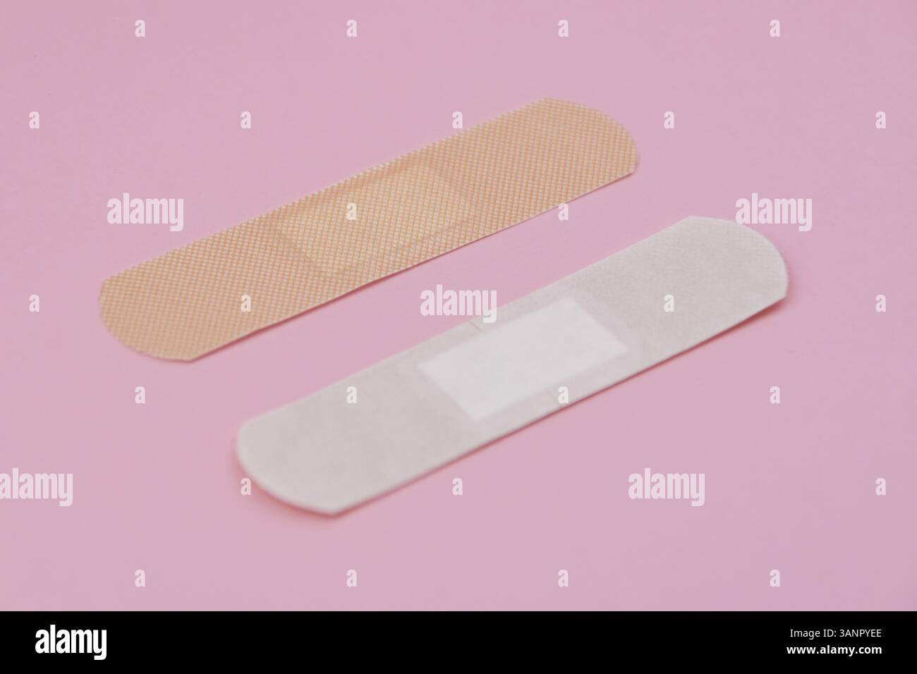 Medical sticking plasters on pink background. First aid. Medical ...