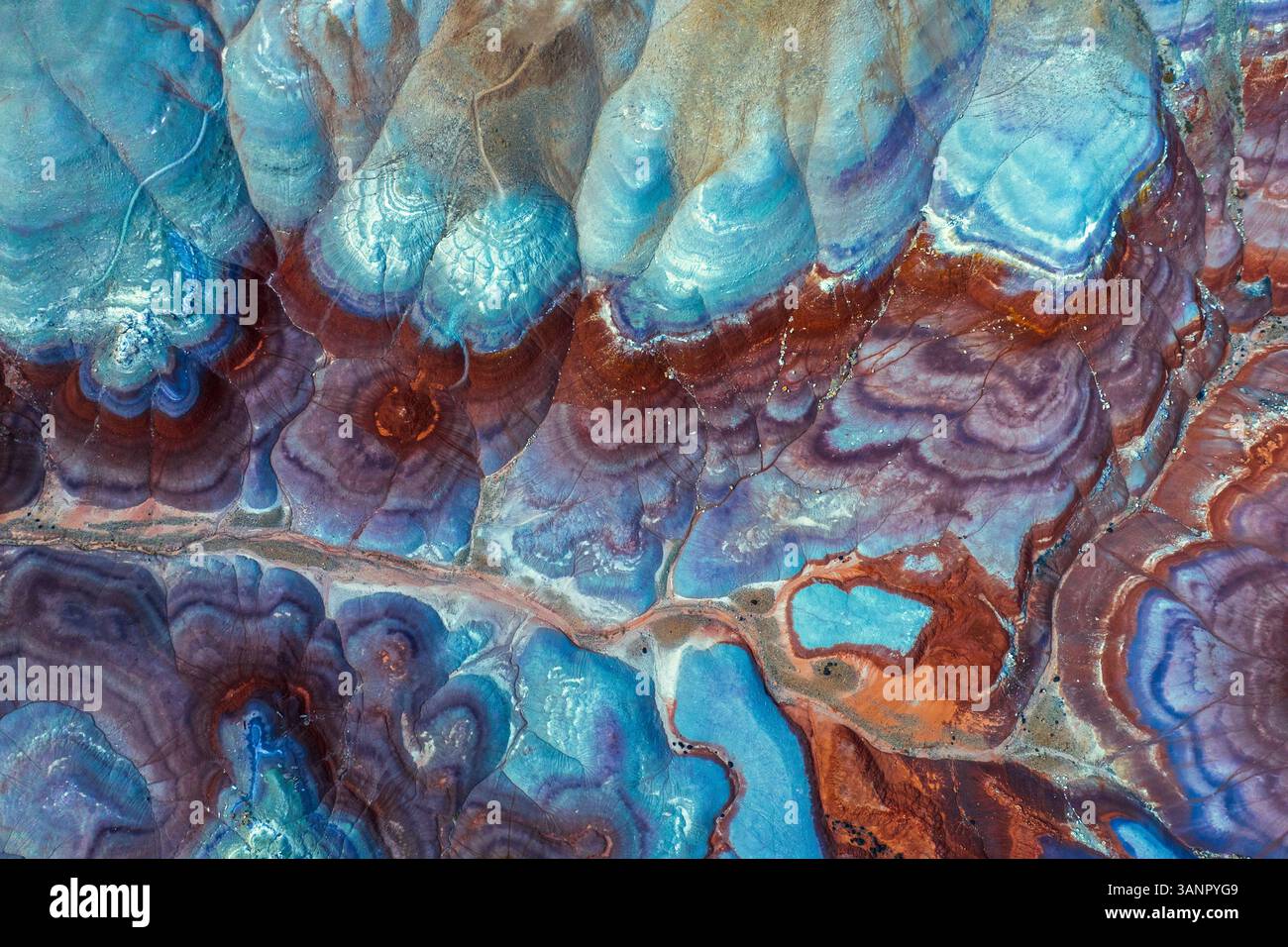 Aerial view of colorful geological formations and vibrant textures in a ...