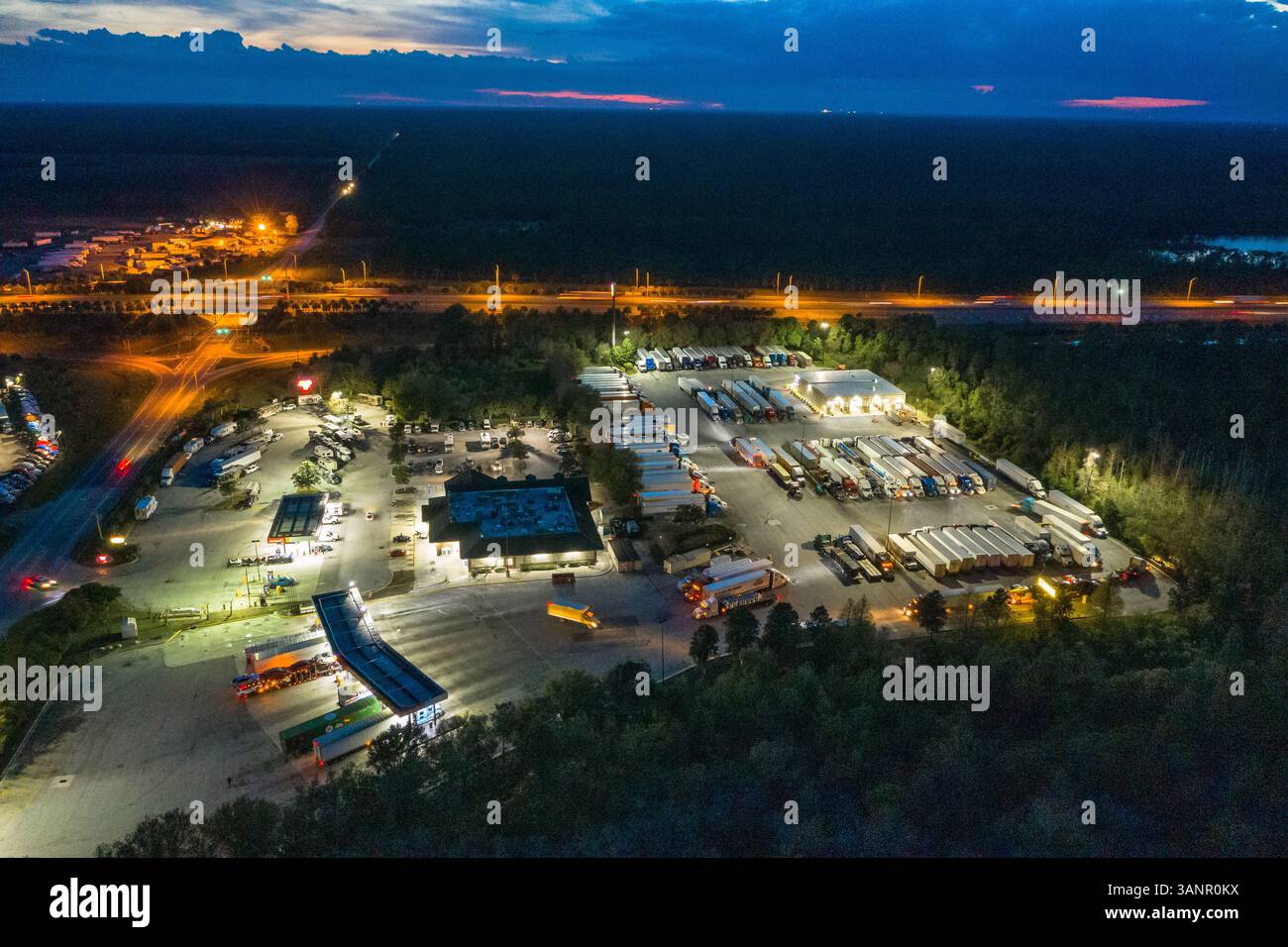 Aerial view of a huge parking lot with parked trucks in St. Augustine ...