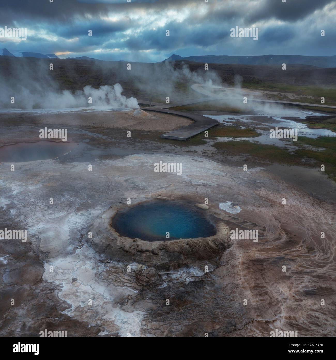 Aerial view of majestic geothermal landscape with geysers and steam ...