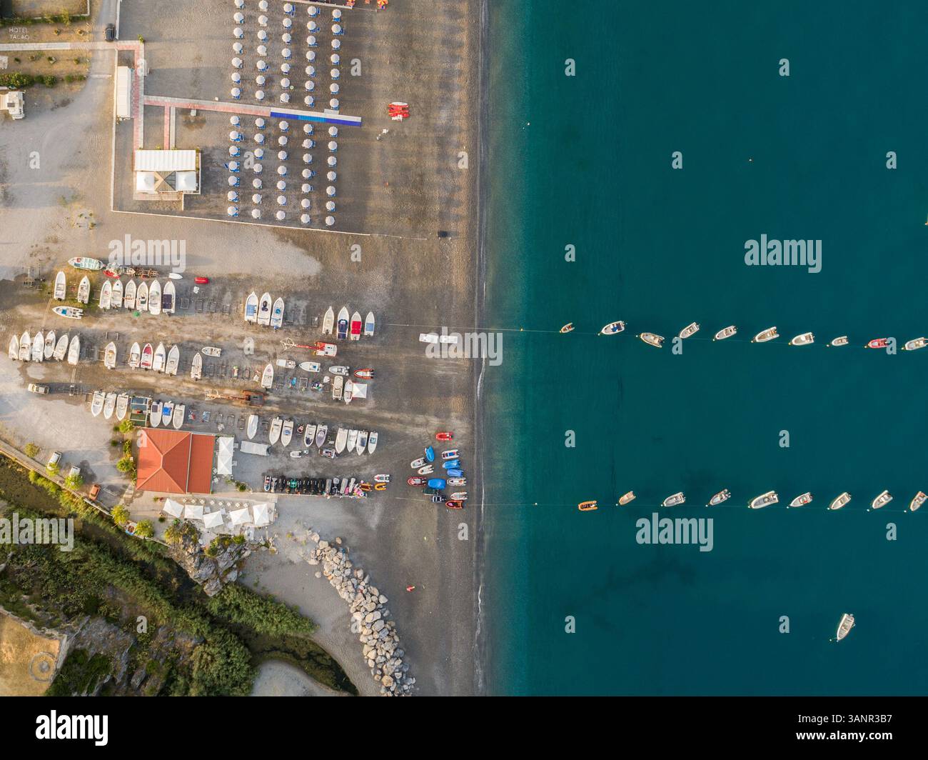 aerial vertical view of anchored boats near seashore of Scalea ...