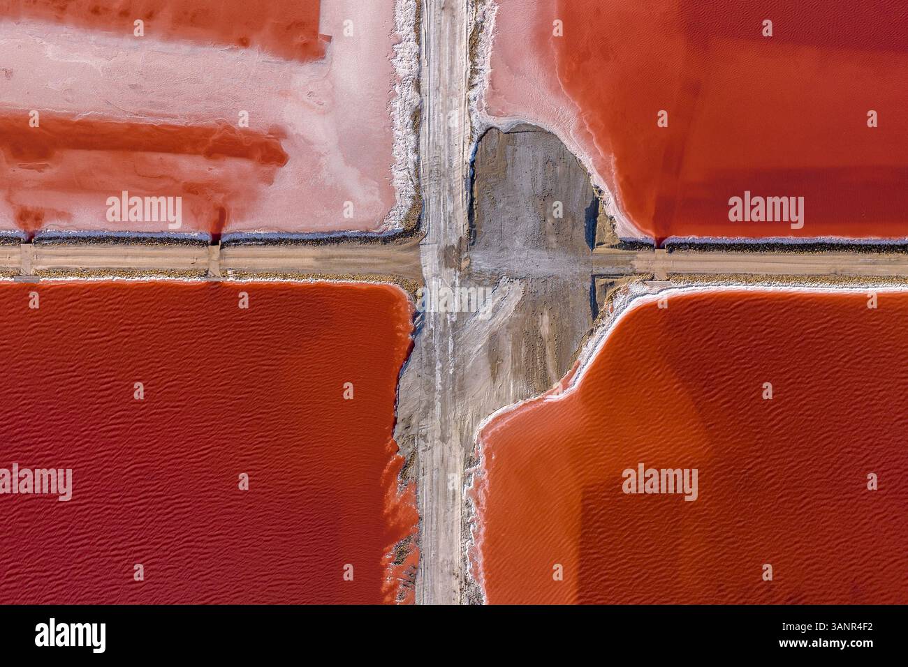 Aerial view of vibrant salt saltern with abstract patterns and colorful ...
