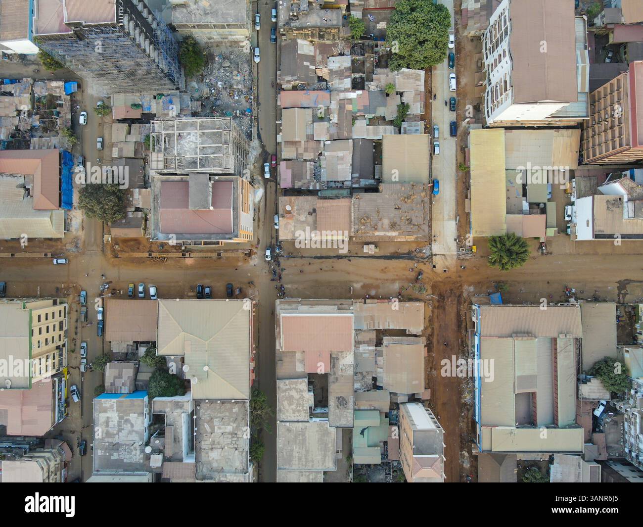 Aerial view of people in the street playing football, Conakry, Guinea ...