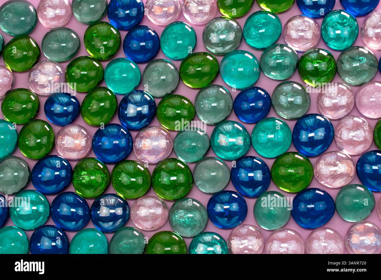 shiny pebbles in rainbow colors top view Stock Photo - Alamy