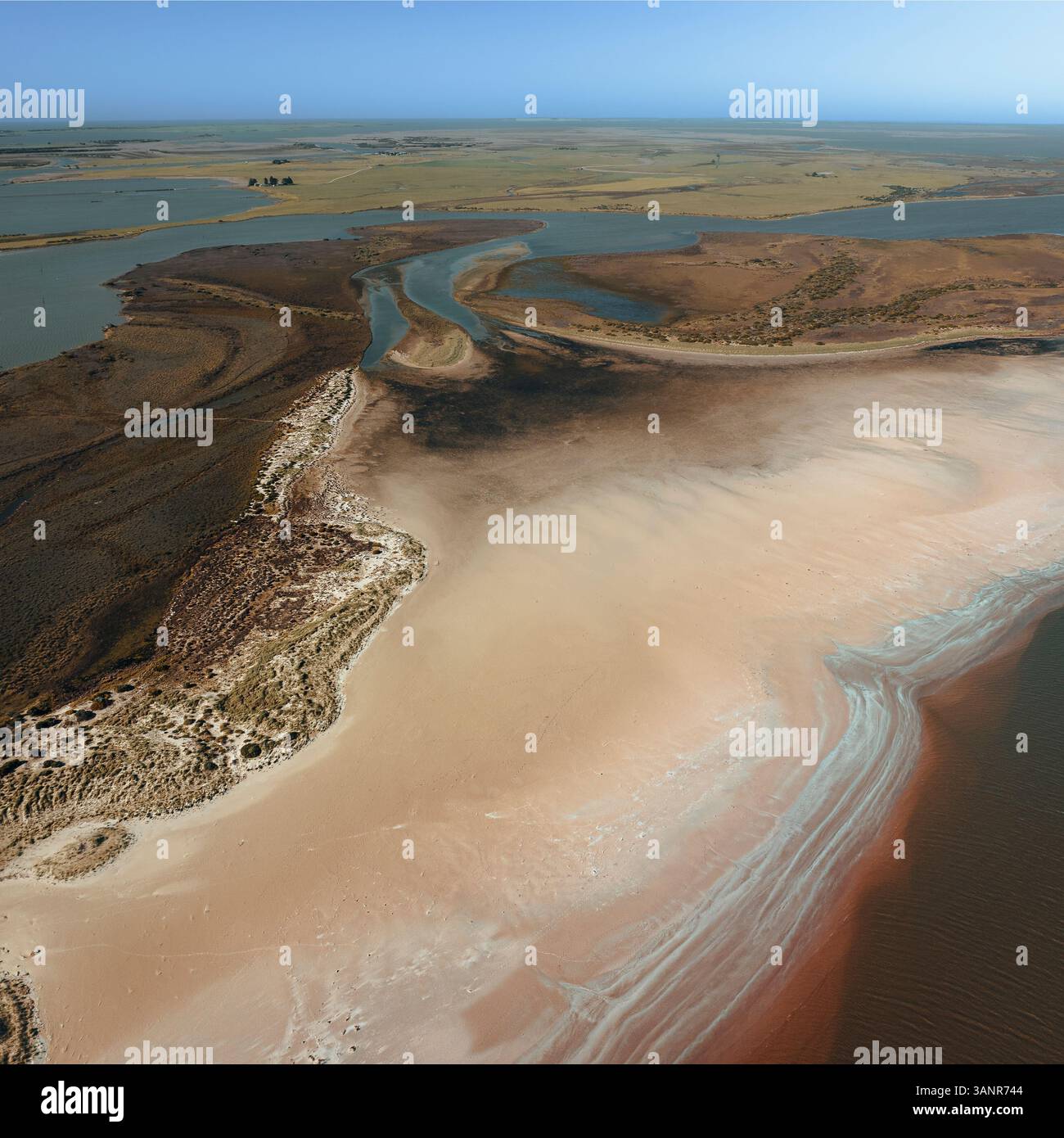 Aerial view of clear river meeting the sea at The Murray Mouth ...