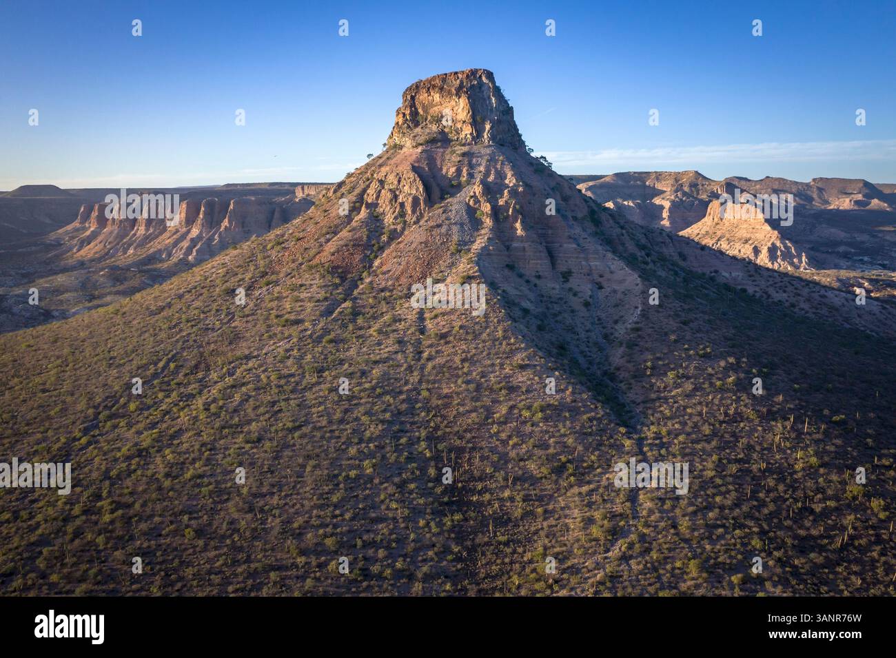 Aerial view of pilon hill with rugged terrain and clear sky, la ...